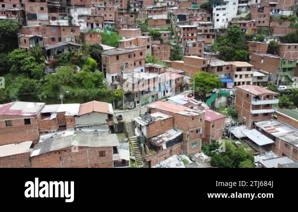 Medellin, Colombia, drone aerial view of Comuna 13 slums, favela. Once ...
