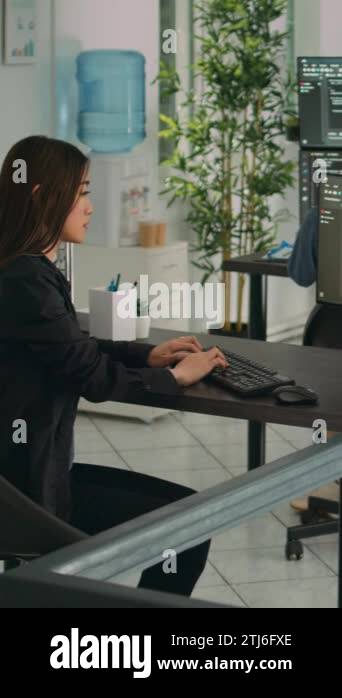Vertical Video Woman Programer Typing Source Code On Computer Keyboard To Develop New App