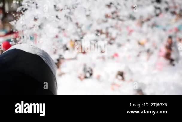 Foam installation for foam party. Foam party on beach blowing from ...