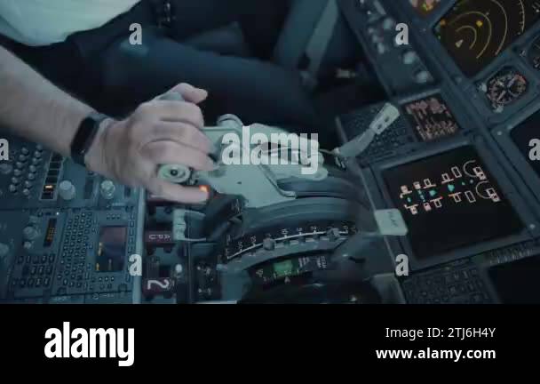 The cockpit, the pilot pulls the lever for takeoff. Close-up of hand ...