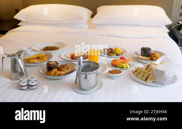 Breakfast in bed in hotel. Room service in modern luxury resort ...
