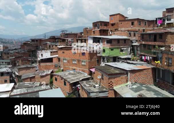 Medellin, Colombia, drone aerial view of Comuna 13 slums. Once one of ...
