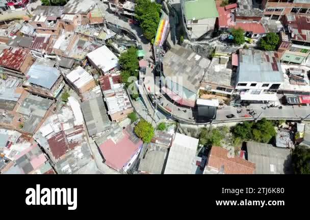 Medellin, Colombia, drone aerial view of Comuna 13 slums. Once one of ...