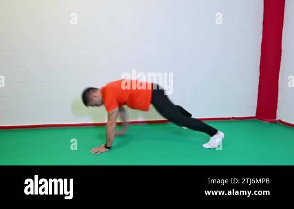 Beautiful footage with young caucasian male athlete trains by ...