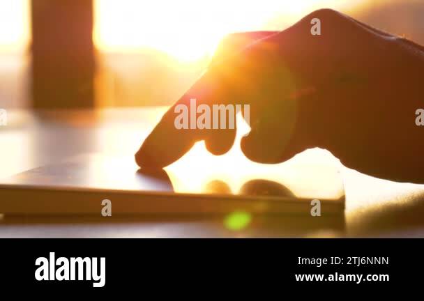 SLOW MOTION, CLOSE UP: Sunrise silhouette of fingers touching and ...