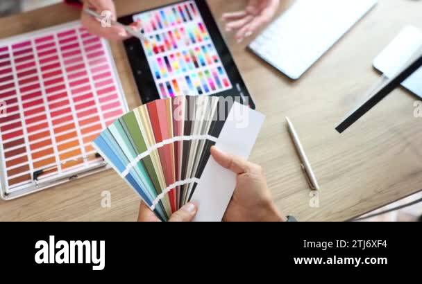 Overview of hands of designers during discussion and selection of ...