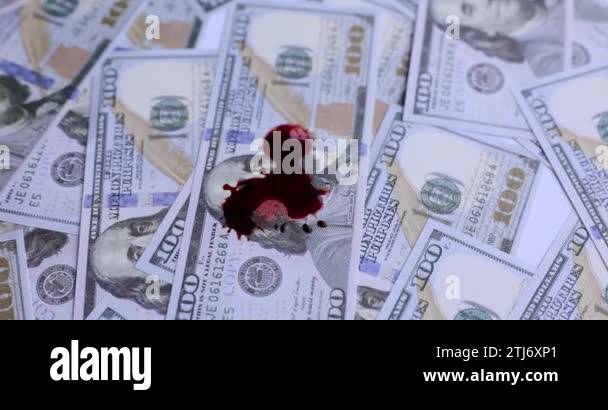 100 dollar bill with blood stains closeup. Blood money and crime Stock ...