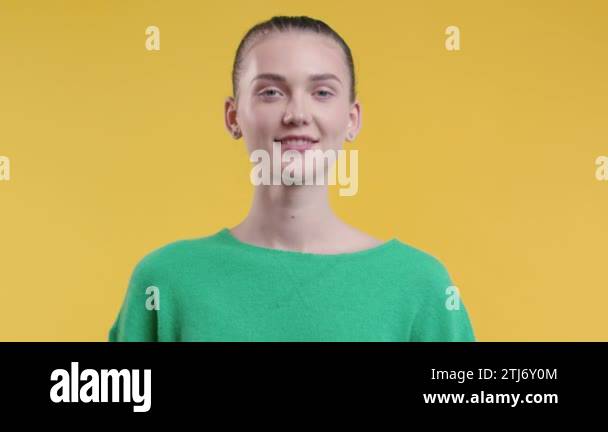 Friendly teenage girl showing yes signal, nods head, approve. Positive ...