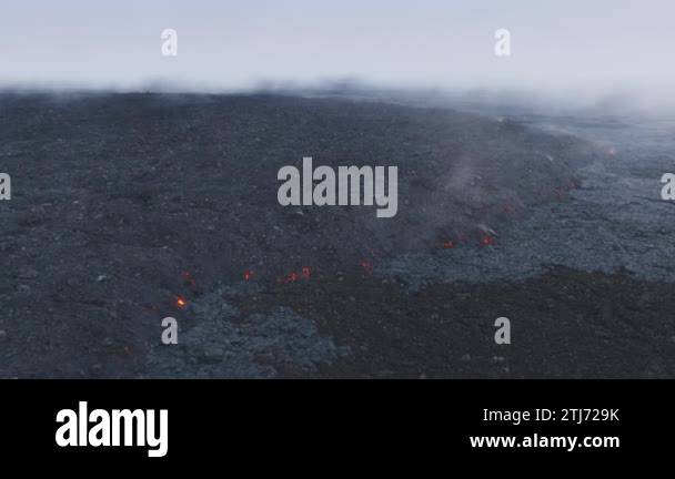 Epic aerial shot on drone of red hot lava flowing and freezing with ...