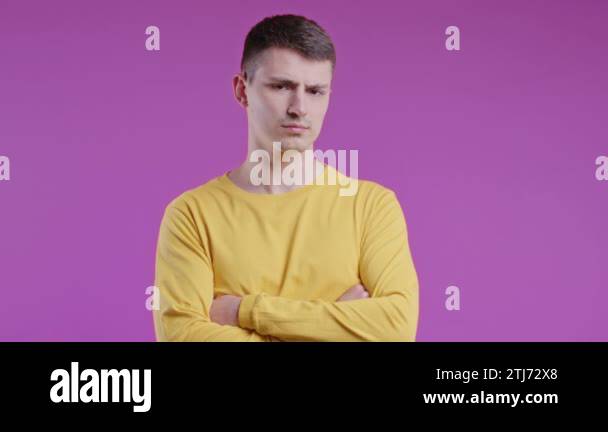 Offended upset young guy with arms crossed feeling mad at someone. Teen ...