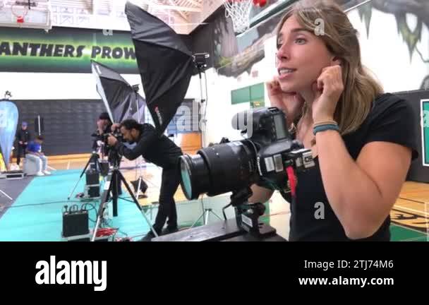 photographer girl instructs how to stand and take pictures correctly ...