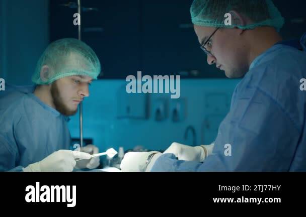 Vets doing surgery operation for pet on table in local vet clinic ...