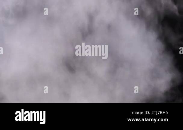 White smoke on black background. A cloud of vapor steam rises up ...