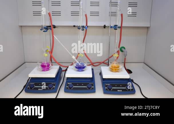 Mixing colored solution with a magnetic stirrer. Formation of a ...