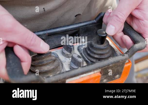 Builder worker working on remote control crane panel, carrying and ...