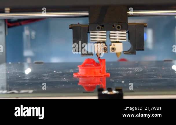 Red abstract model printing on 3D printer close-up. Process printing ...