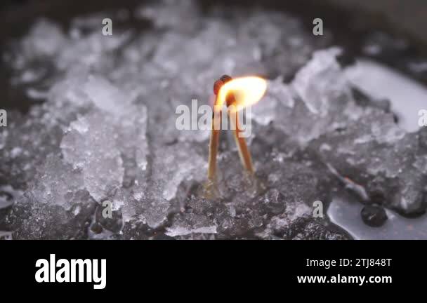 Two Burning Matches are Connected in a Flame of Fire on Wet Snow ...