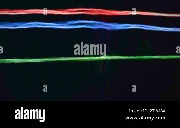 Bright waveforms showing information monitoring on black screen macro ...