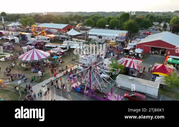 Ferris Wheel and Merry Go Round at outdoor state fair farm on ...