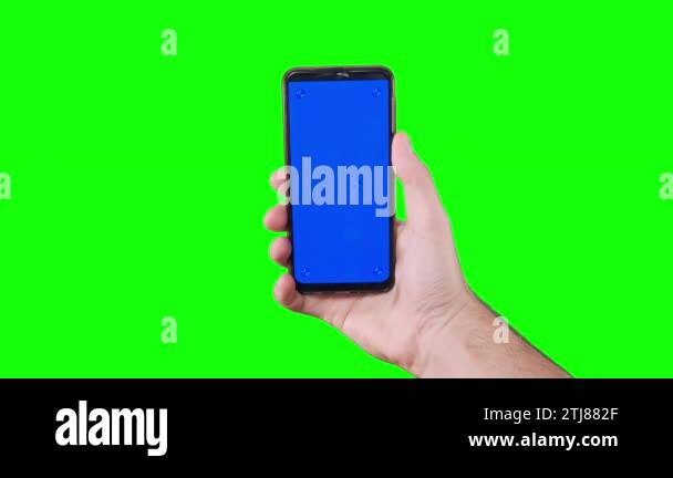Male hand holding a smartphone with a blue screen and trackers on a ...