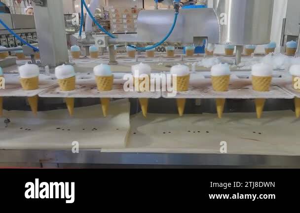 Ice cream on the conveyor line. Ice cream cone on the conveyor ...
