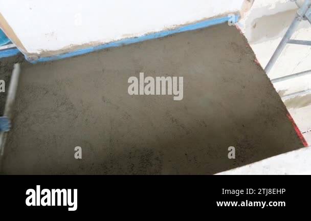 Laying and levelling screed on a balcony - construction site Stock ...