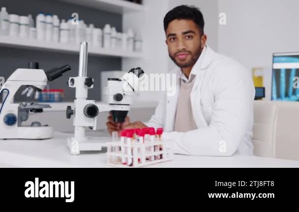 Scientist, man face and microscope blood sample in a laboratory for ...