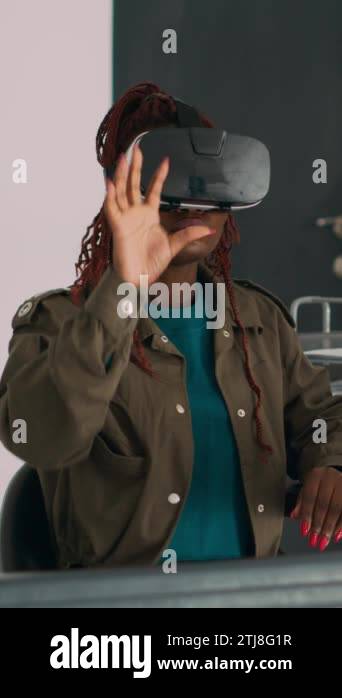 Vertical video: African american developer working with vr glasses to create programming server ...