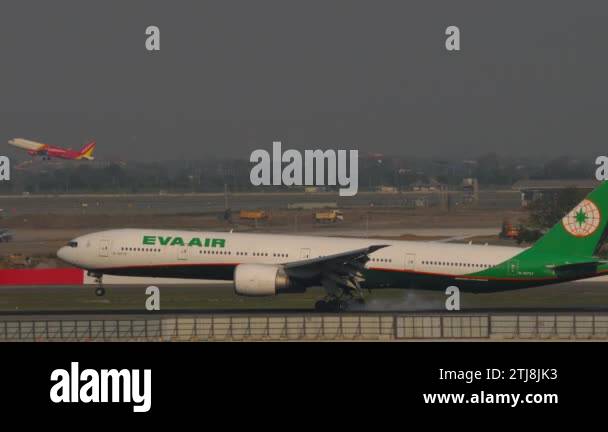 BANGKOK, THAILAND - MARCH 01, 2023: Row of planes parked near the ...