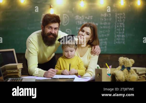 Young family studying. Cute little kid boy learning with parents ...