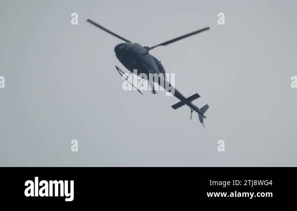 Helicopter flying in the sky low angle shot footage. Helicopter in ...