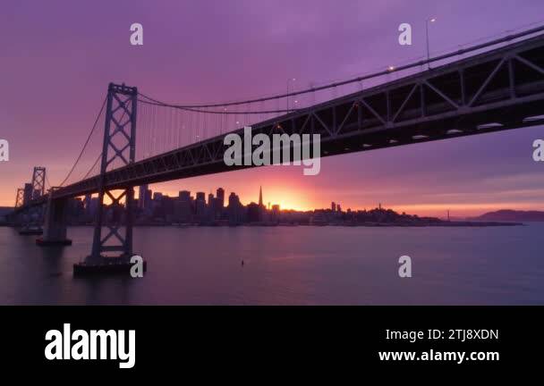 San Francisco skyline and Bay Bridge at epic pink sunset, California ...