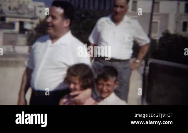 Italian uncle dances with kids on rooftop Stock Video Footage - Alamy