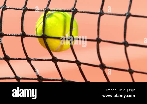 Super Slow Motion Shot of Tennis Ball Hitting the Net on Court at ...