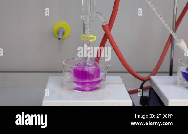 Mixing colored solution with a magnetic stirrer. Formation of a ...