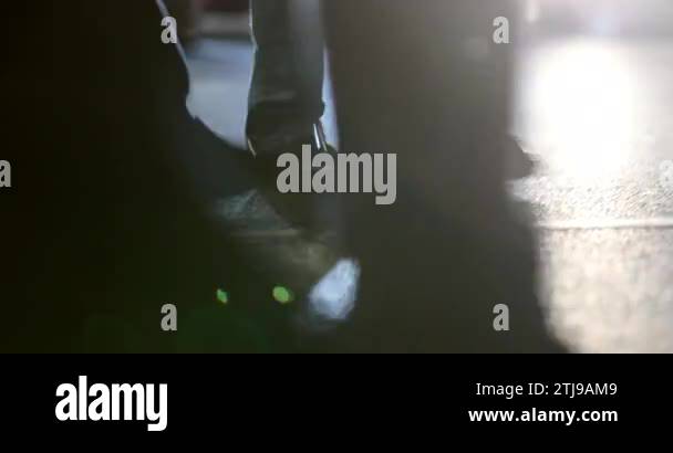 Crowded Low-angle perspective of pedestrians crossing street with lens ...