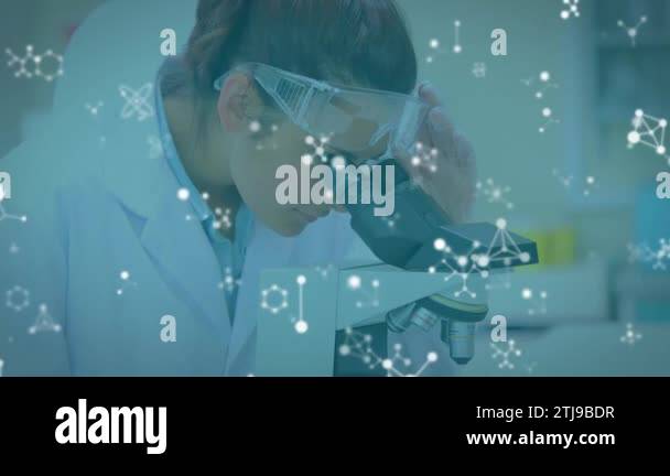 Animation of molecules over female caucasian scientist looking through microscope in laboratory ...