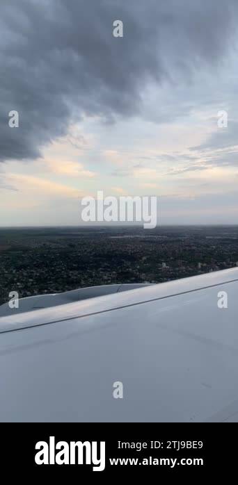 Travelling by air plane, looking through plane window enjoying ...