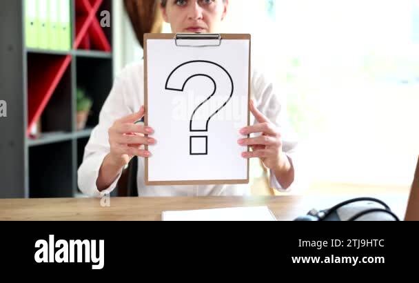 Nurse shows white sheet with question mark. Medical issues related to treatment Stock Video ...