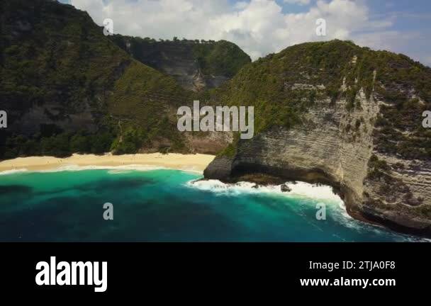 Dramatic aerial drone footage of the famous Kelingking beach, aka T Rex ...