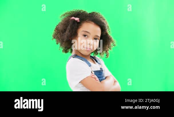 Face, eyebrows and child on green screen with attitude, arms crossed and confident on mockup ...