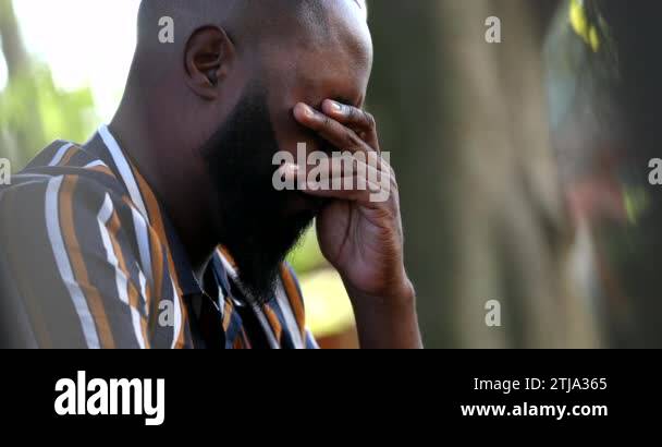 Worried man praying to God during difficult times, frustrated person ...