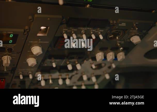 Airplane captain starting aircraft engine power buttons on control ...