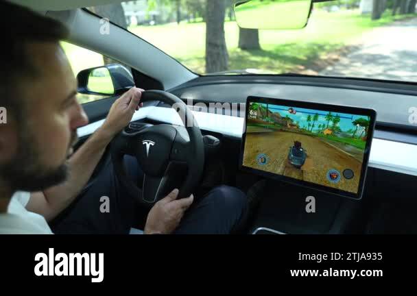 Driving tesla Stock Videos & Footage - HD and 4K Video Clips - Alamy