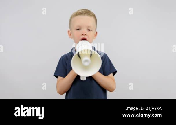 Portrait of little child boy speaking his speech in loudspeaker on ...