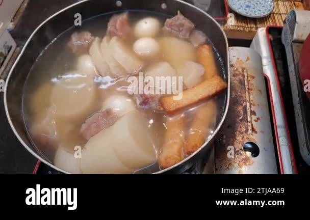 Oden radish nd fish cake soup cooking seafood crab soup in fish market ...