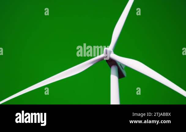 2X slow motion video of large wind turbines spinning on green screen ...