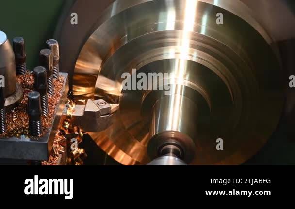The pan scene of lathe machine finish cutting the brass disk parts by ...