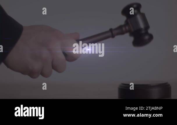 Animation of man hitting with hammer at auction with glowing purple ...