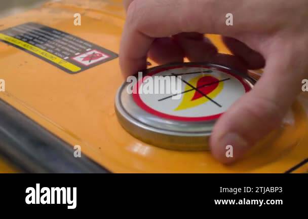 Close-up of unscrewing the gas tank cap of a gas generator. The hand ...